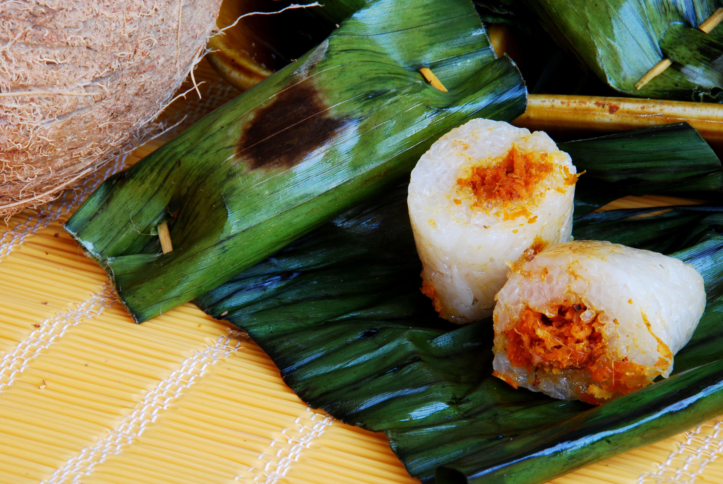 Pulut Panggant (Sweet rice with coconut and shrimp and wrapped in ...